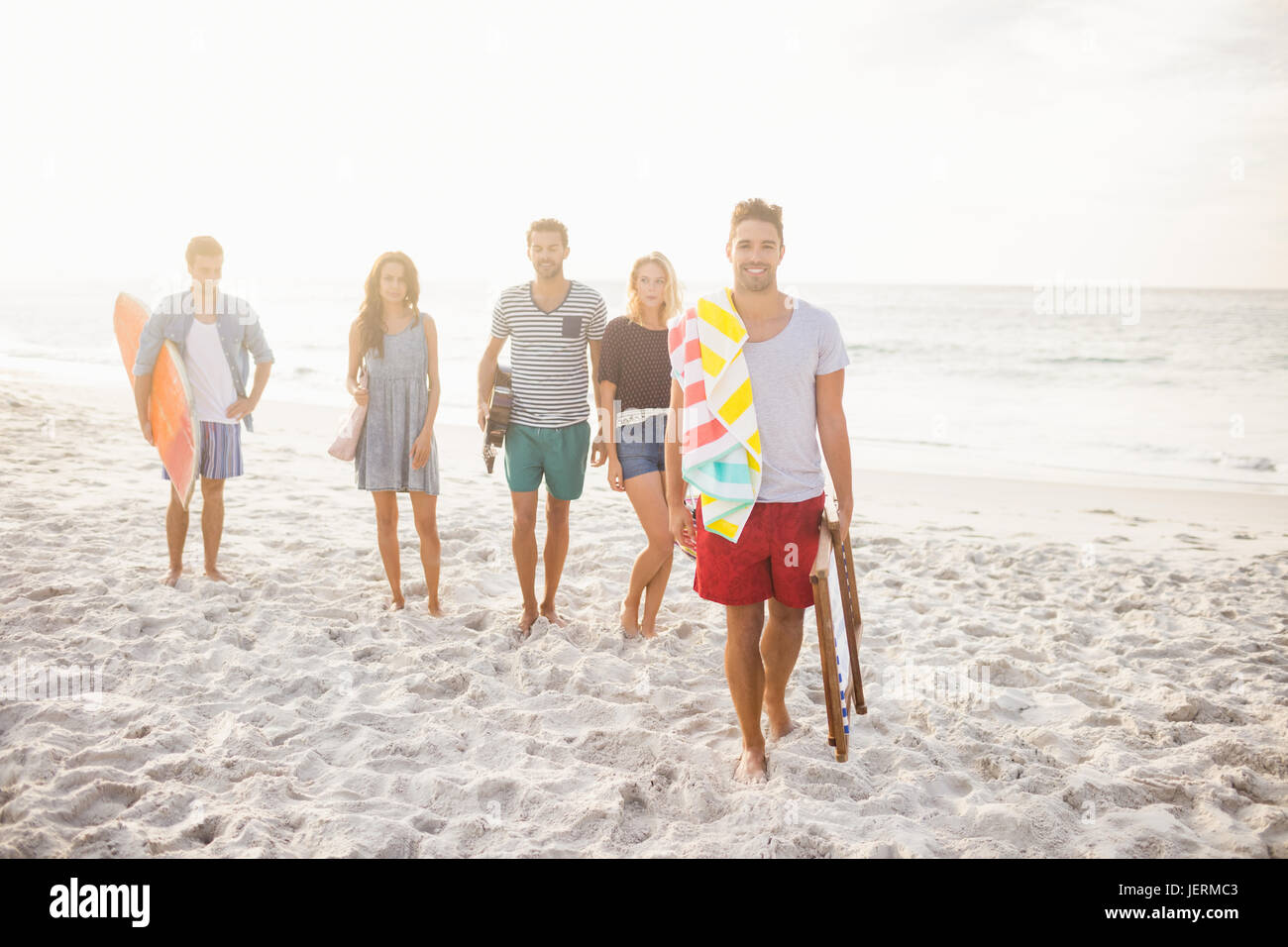 Happy friends bringing their stuff Stock Photo - Alamy