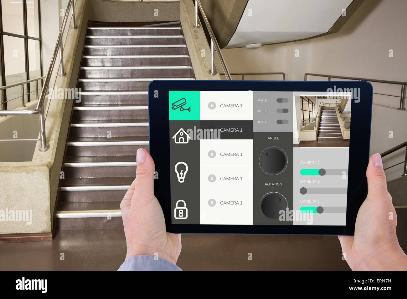 Man using tablet for home automation Stock Photo - Alamy