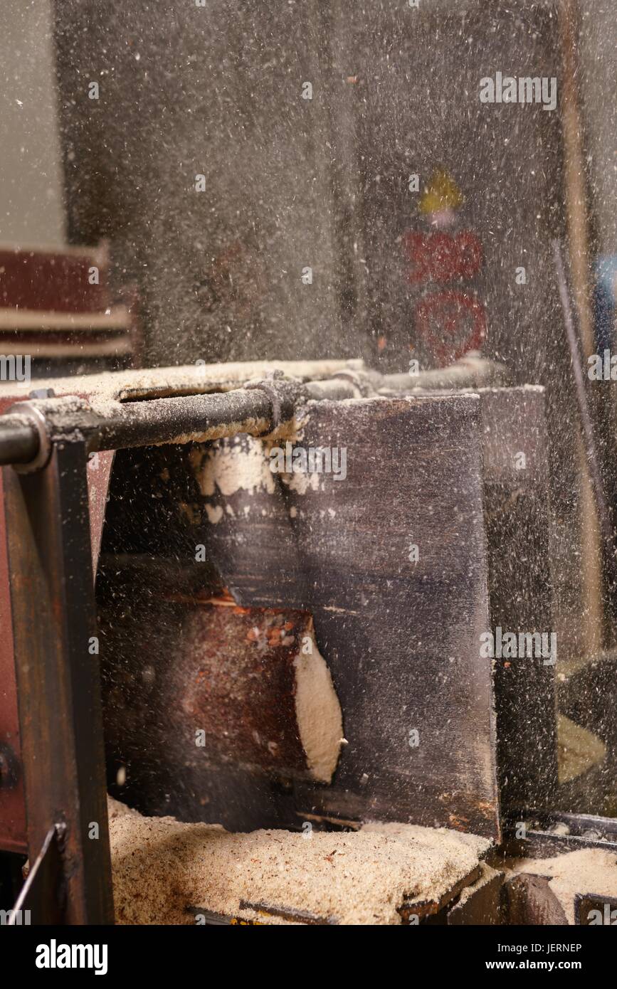 Image of sawing wood and sawdust flying Stock Photo - Alamy