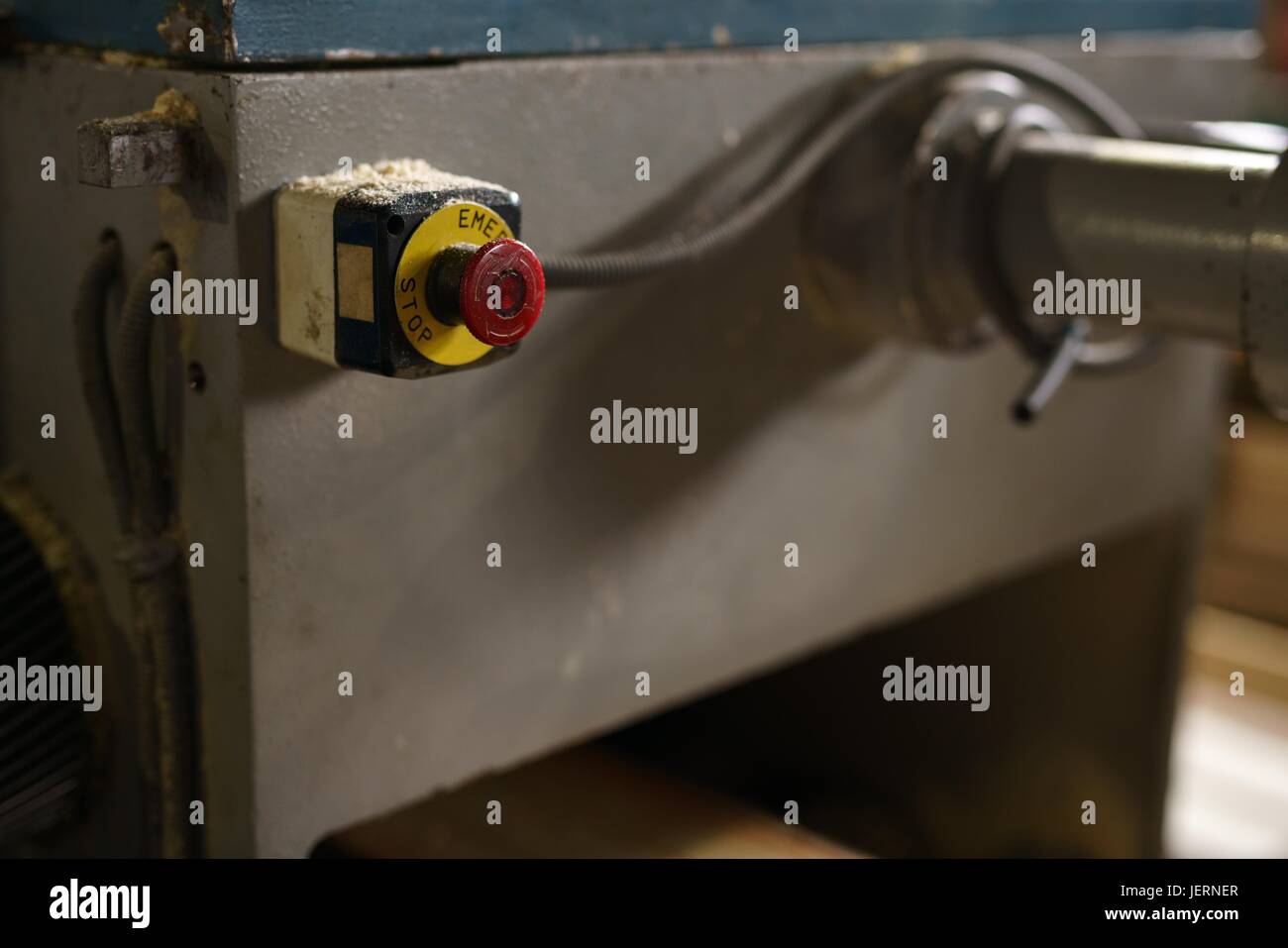 At sawmill. Stop button on machine, close-up Stock Photo - Alamy
