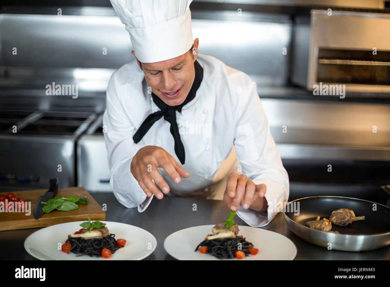Chef preparing food in kitchen Stock Photo - Alamy