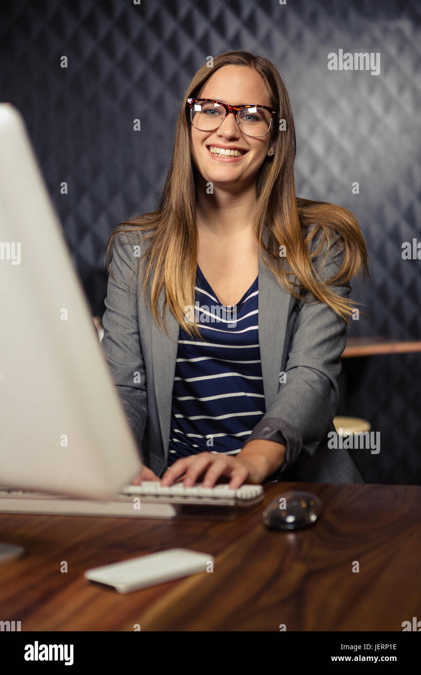 Creative businesswoman using computer Stock Photo - Alamy