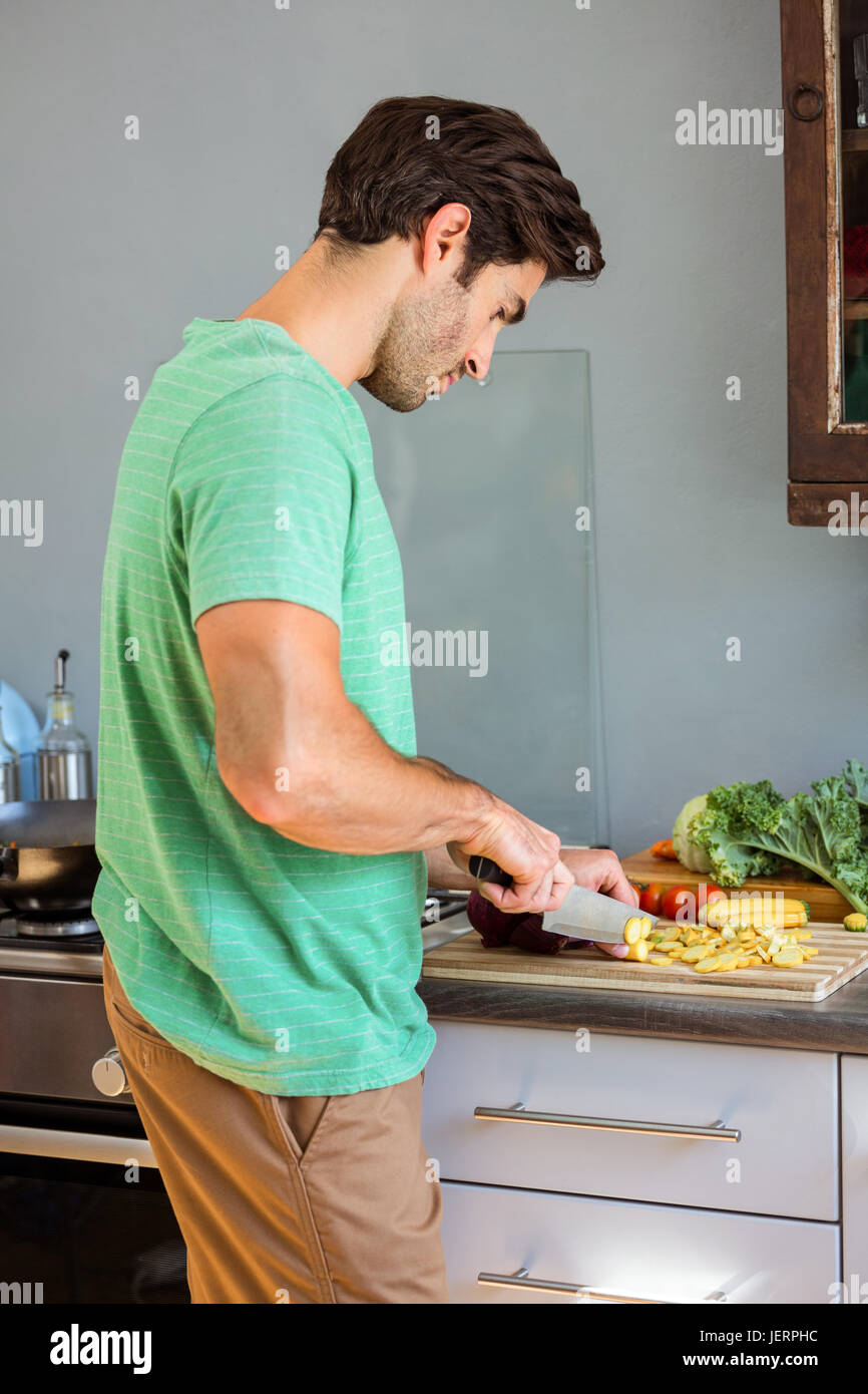 Man chopping vegetables Stock Photo - Alamy
