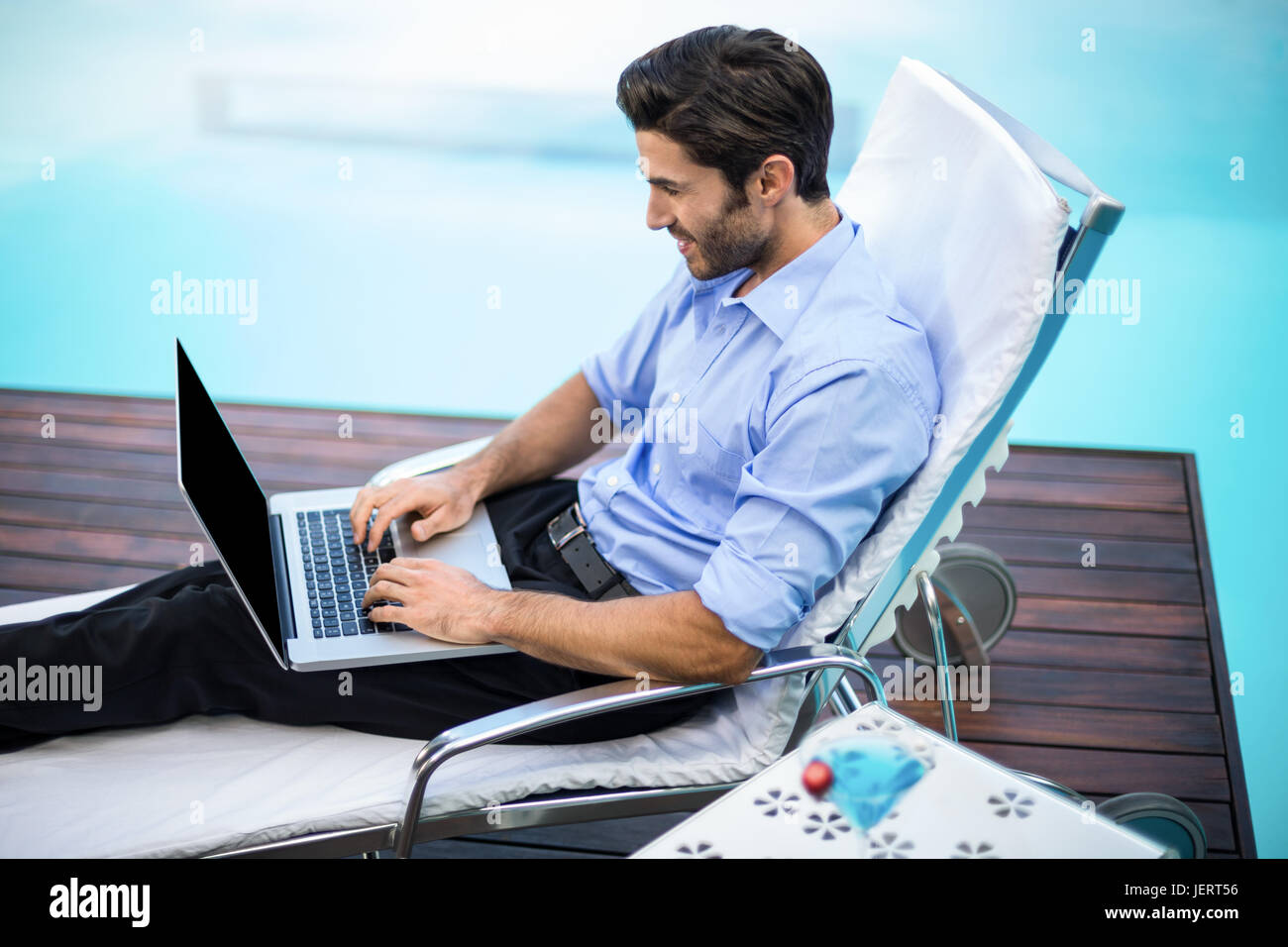 Laptop computer cocktail pool hi-res stock photography and images - Alamy