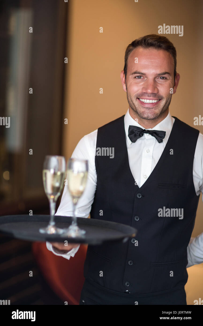 Waiter smiling at camera Stock Photo - Alamy
