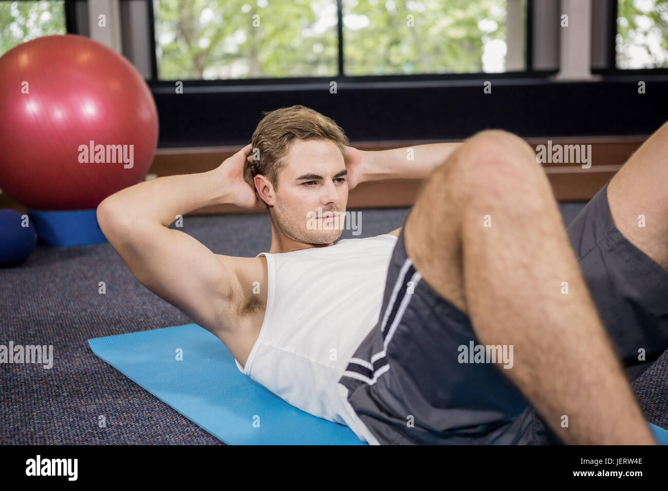Man doing abdominal crunches Stock Photo - Alamy