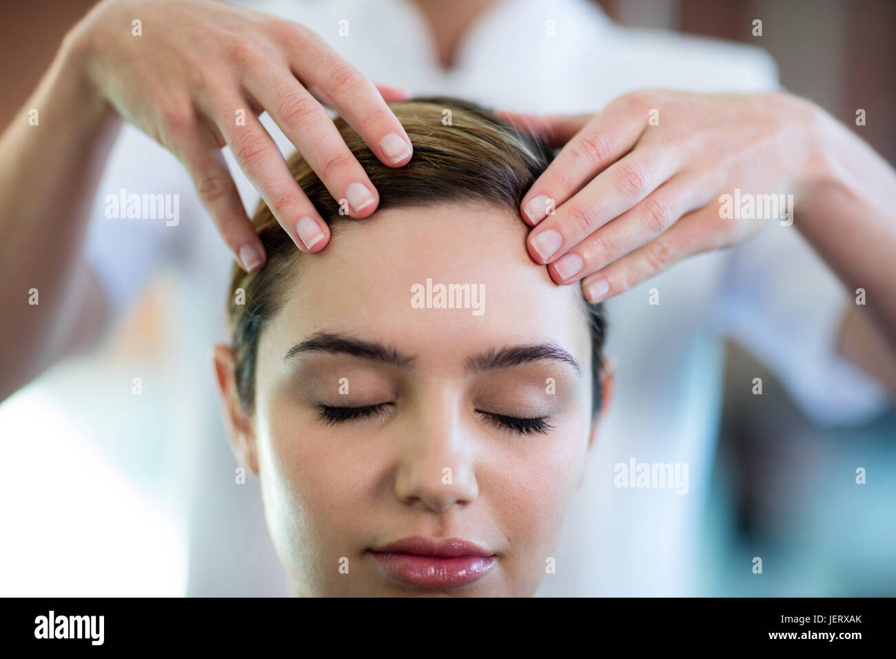 Woman receiving a head massage Stock Photo - Alamy