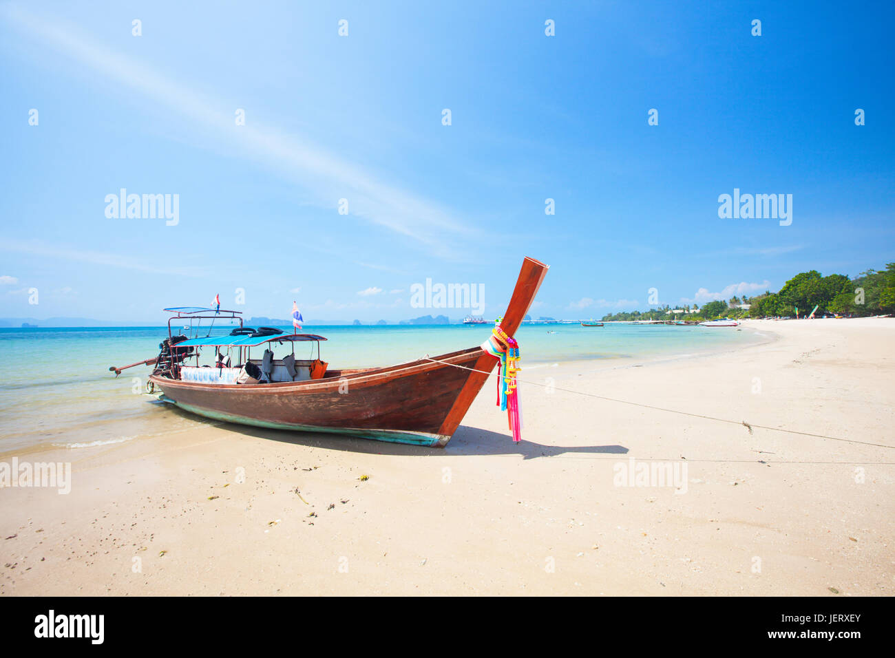 Long tail boat on tropical beach Stock Photo - Alamy