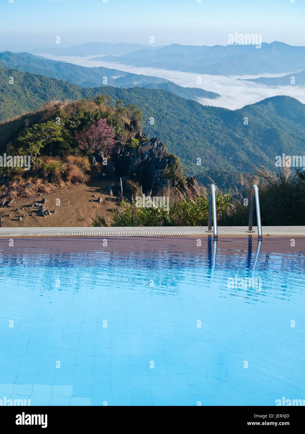 Outdoor swimming pool on top of mountain with mist Stock Photo - Alamy