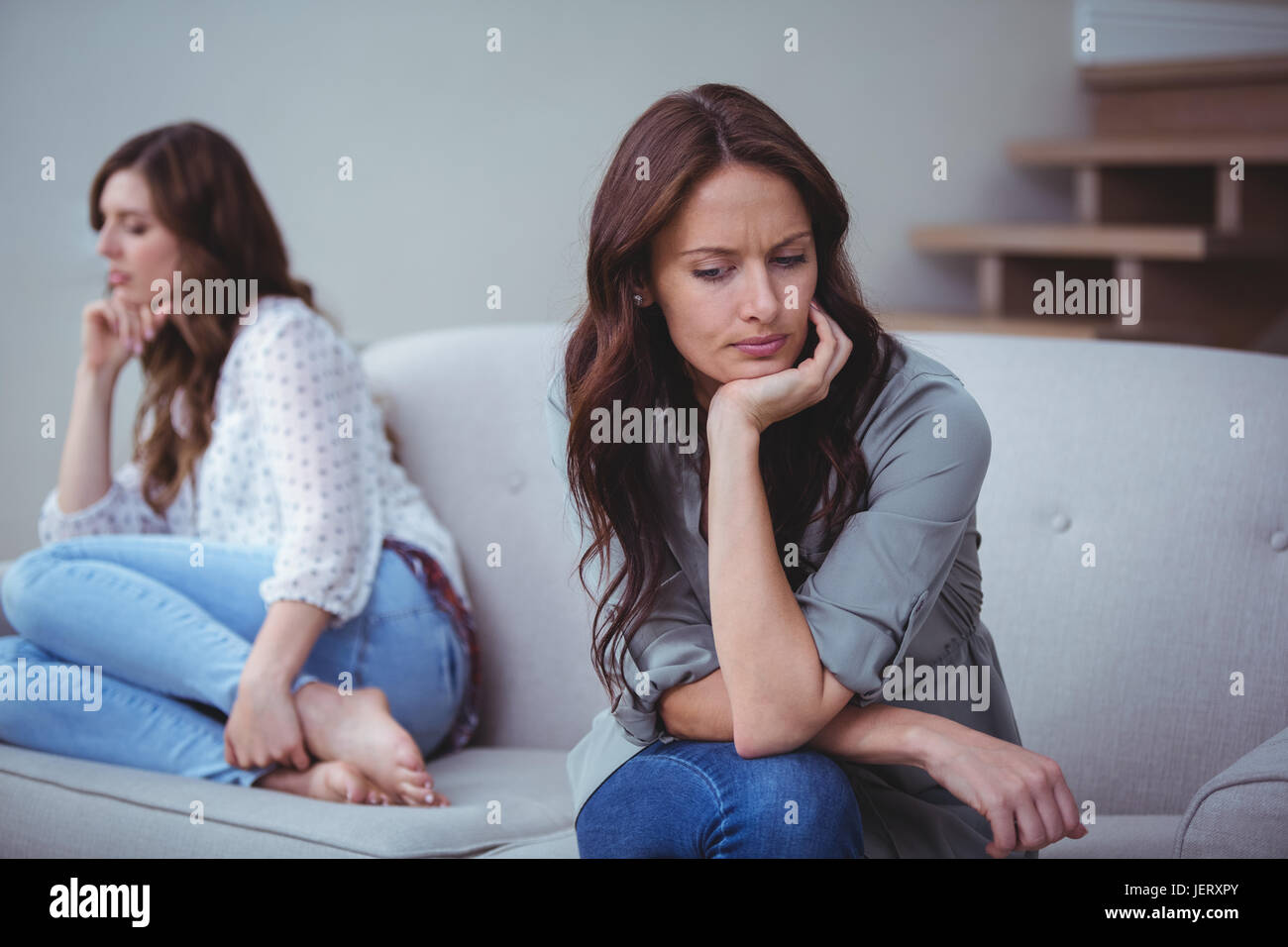 Woman ignoring her friend after an argument Stock Photo - Alamy
