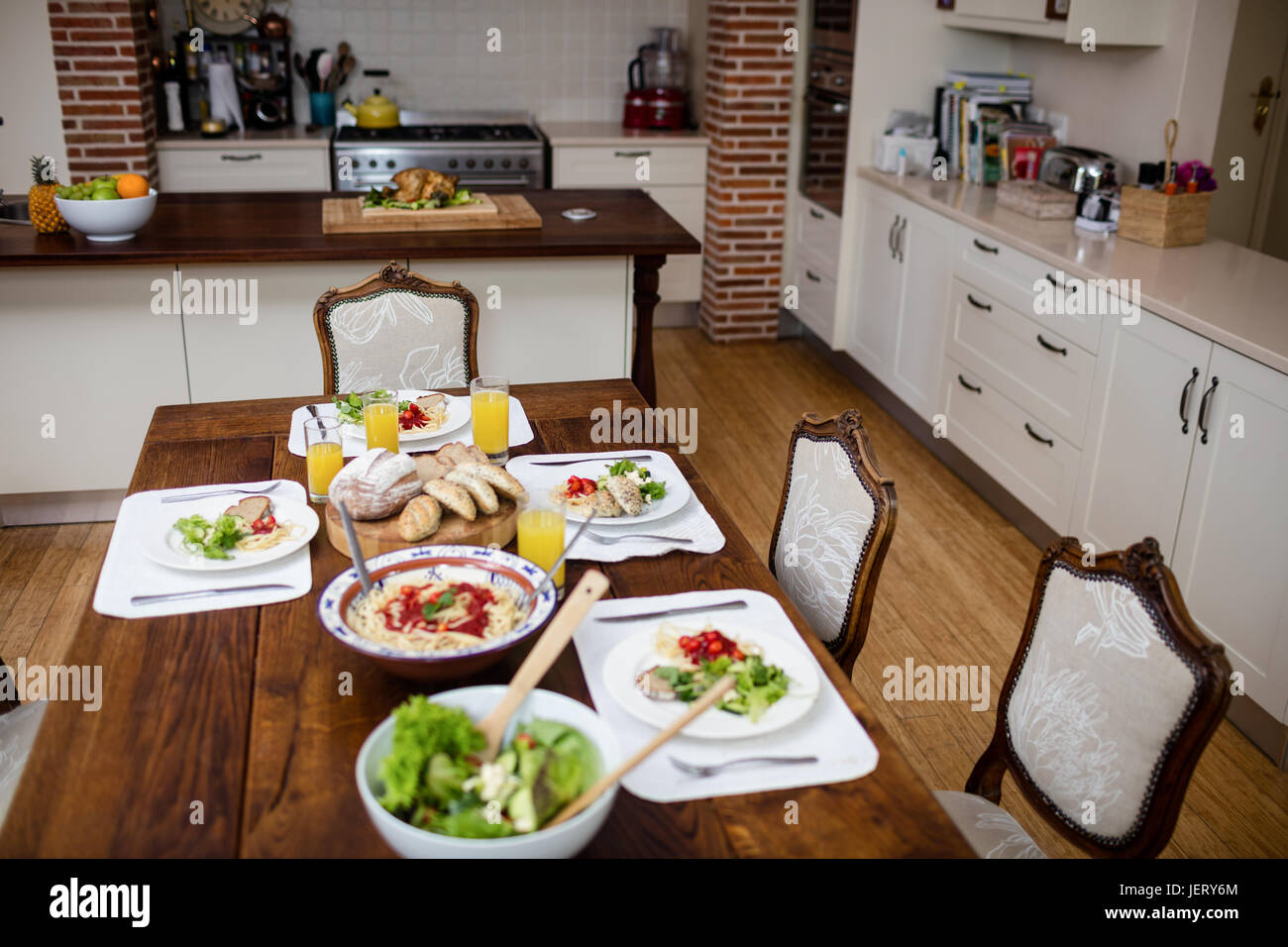 Dinning table laid with meal Stock Photo - Alamy
