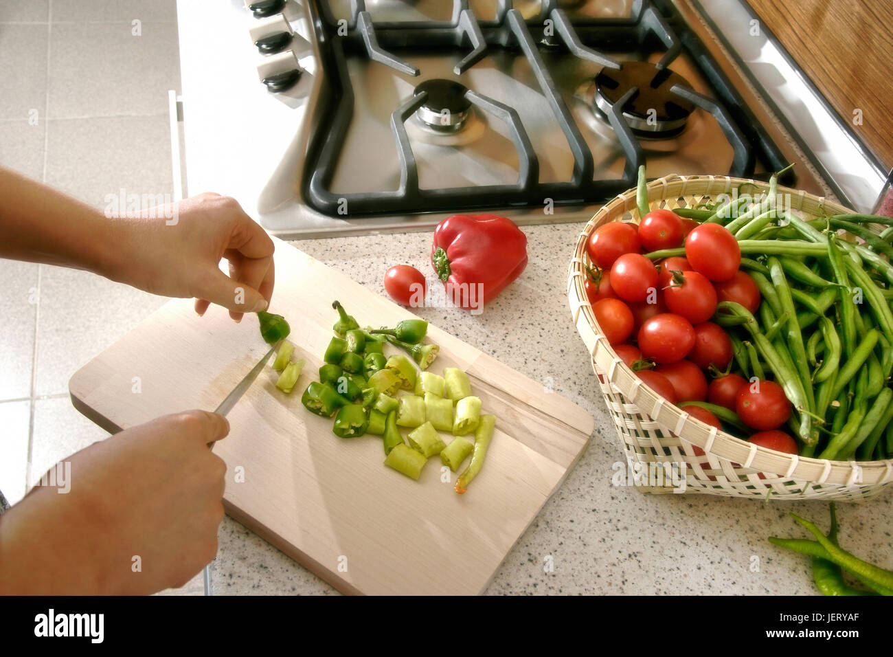 woman cutting vegetables in domestic kitchen Stock Photo - Alamy