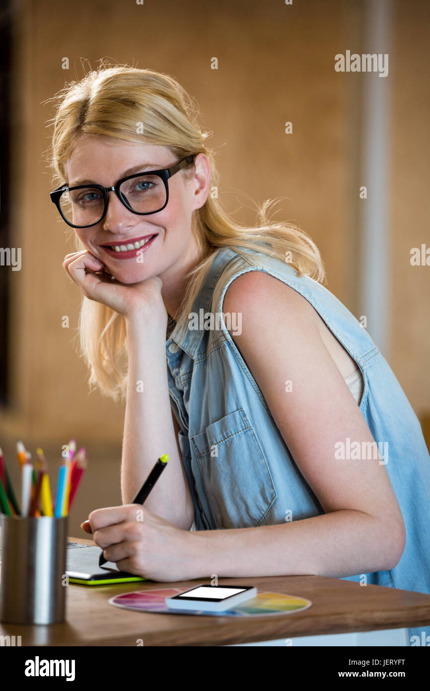 Creative woman drawing on a graphic tablet Stock Photo - Alamy