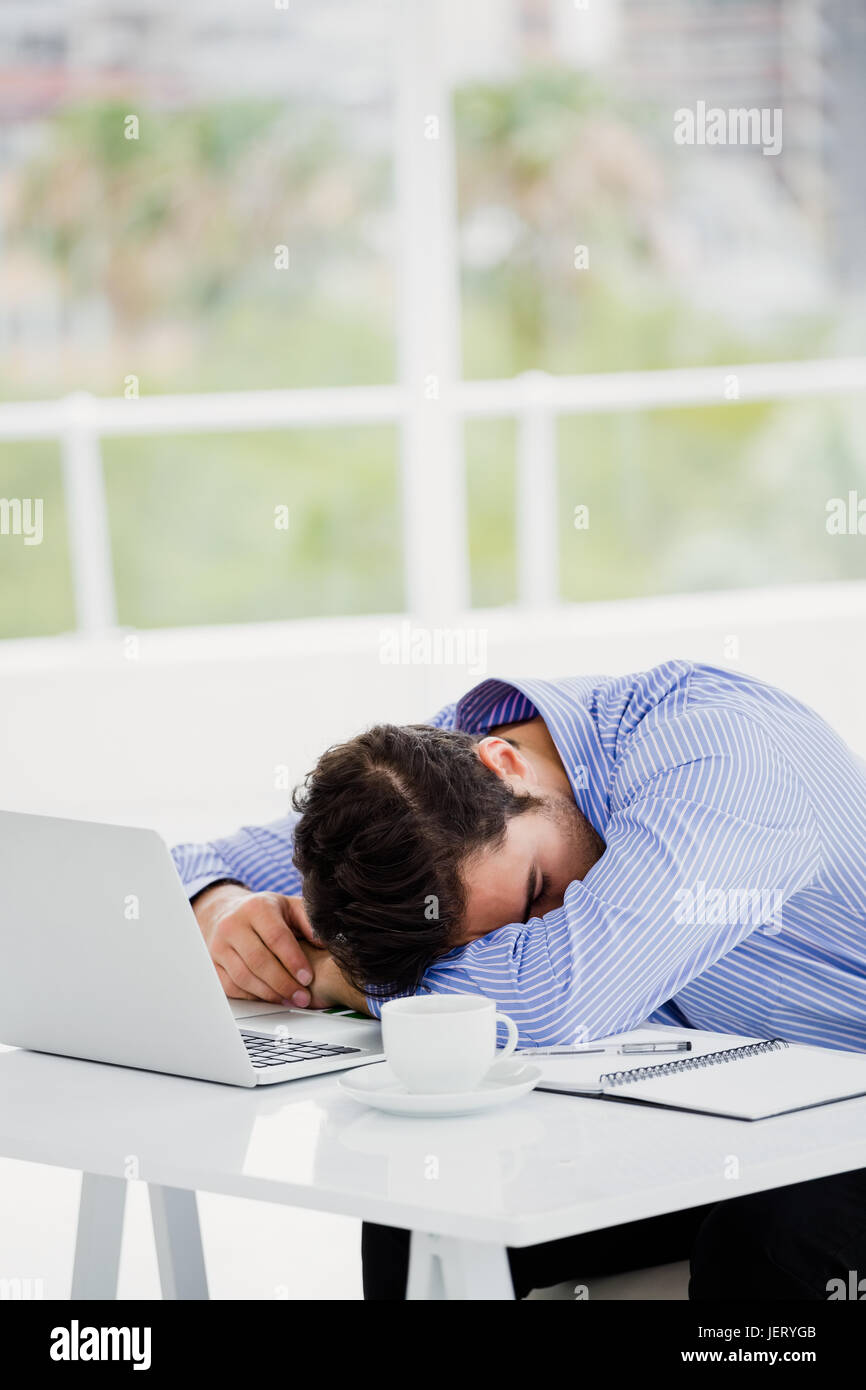 Businessman sitting desk laptop putting hi-res stock photography and ...