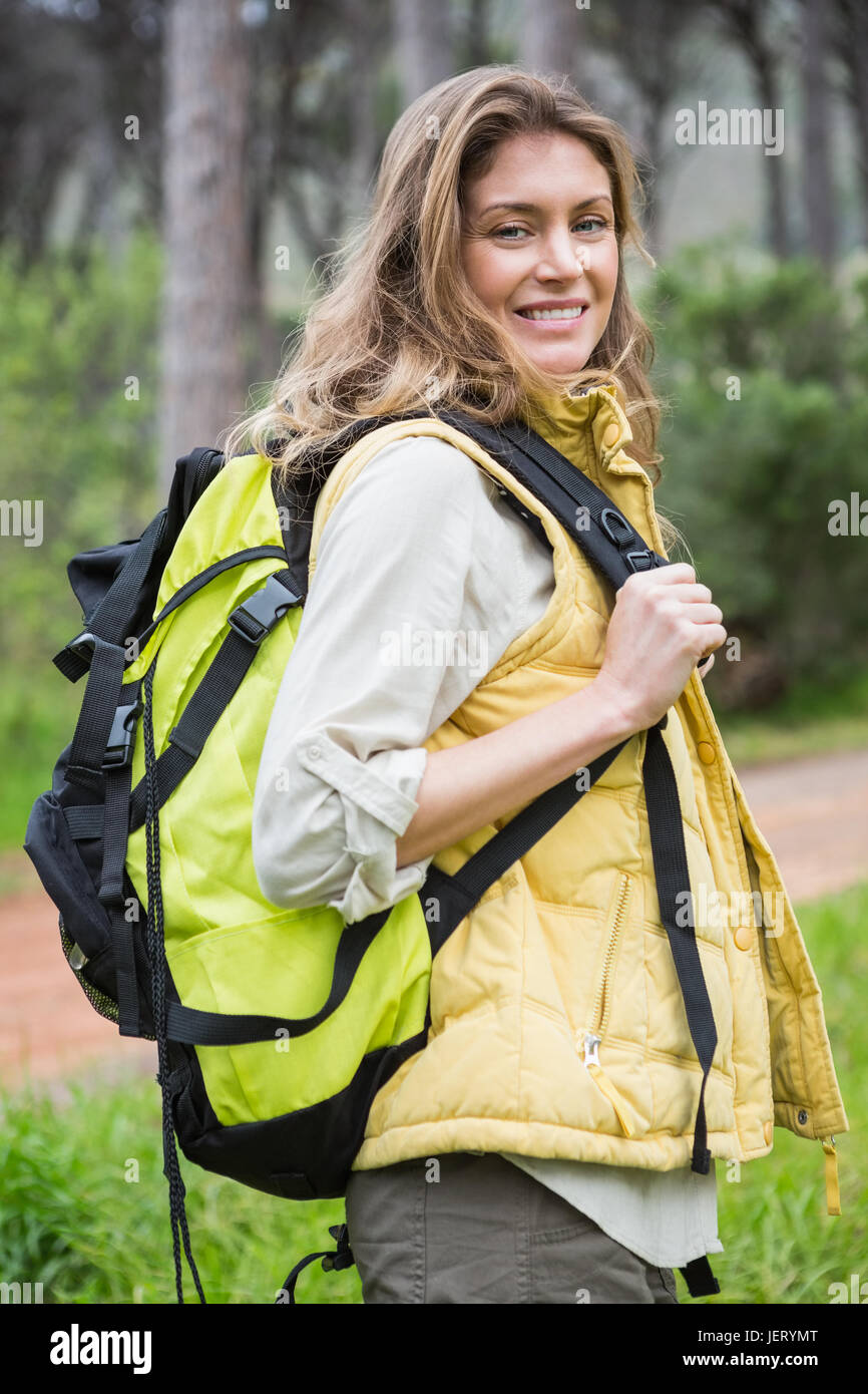 Smiling woman with backpack Stock Photo - Alamy