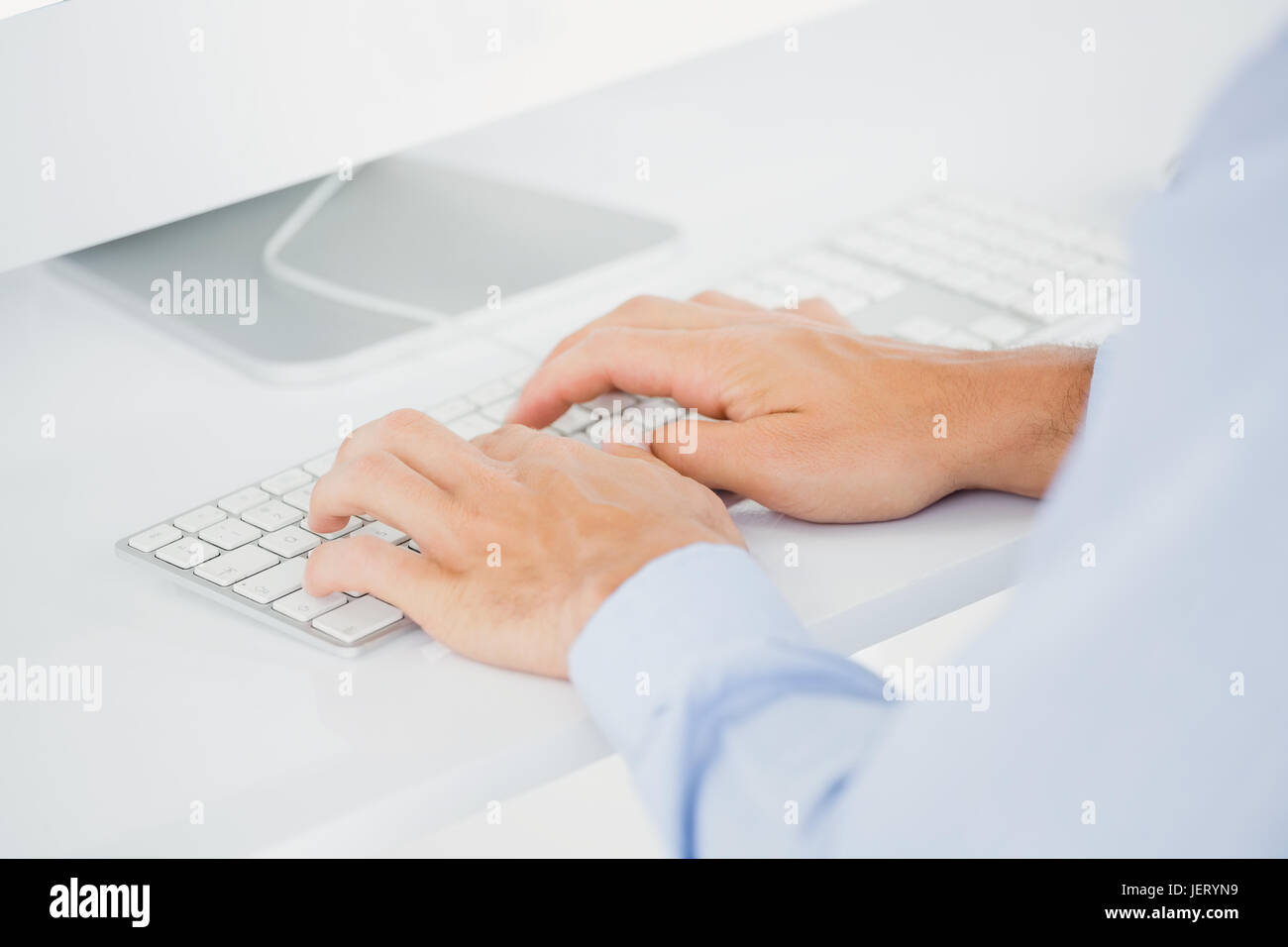 Mid-section of hand working on computer Stock Photo - Alamy