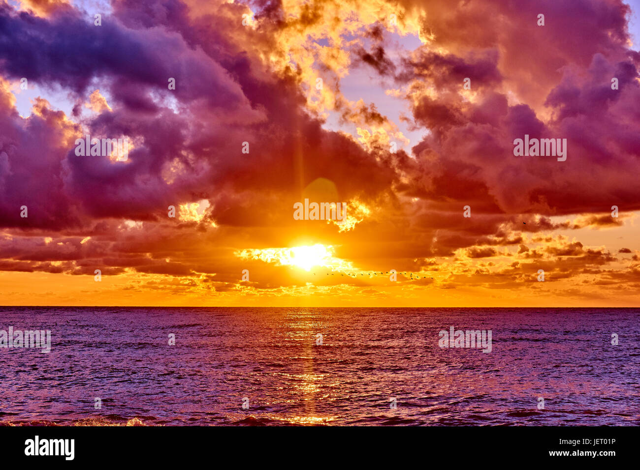sunset over ocean. Sunset on the beach with beautiful sky. Dramatic ...