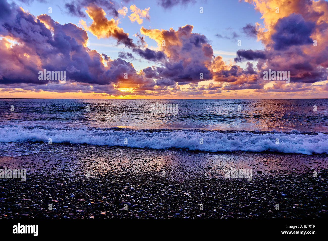 sunset over ocean. Sunset on the beach with beautiful sky. Dramatic ...