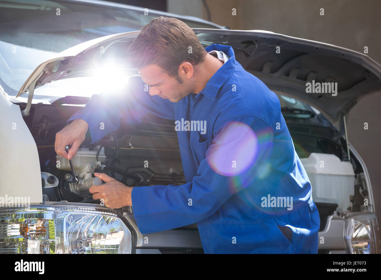 Mechanic examining the car Stock Photo - Alamy
