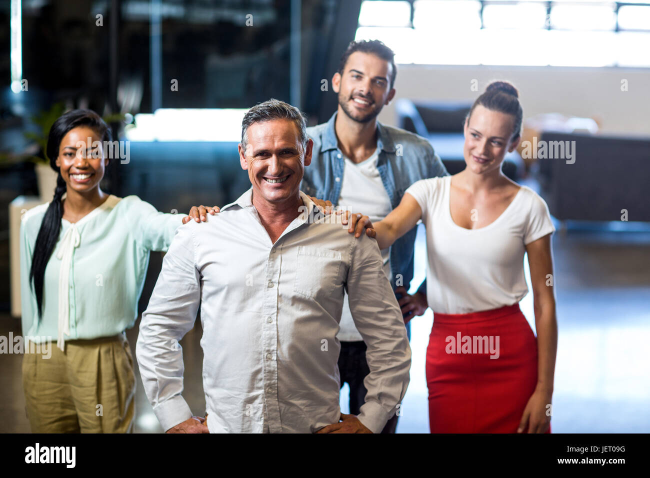 Team of colleagues posing together Stock Photo - Alamy