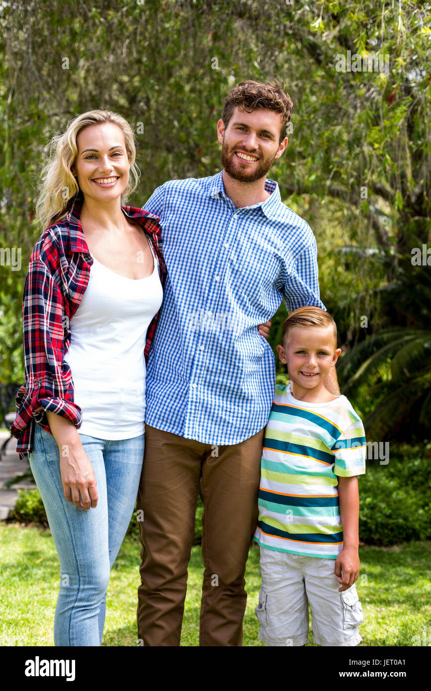 Portrait of happy family standing at yard Stock Photo - Alamy