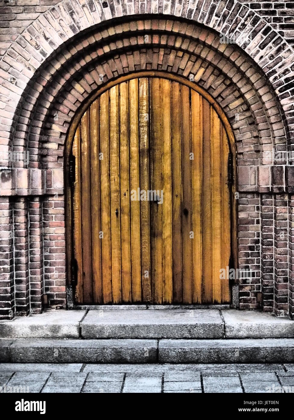 Old traditional wooden arched doorway to a church in the Netherlands ...