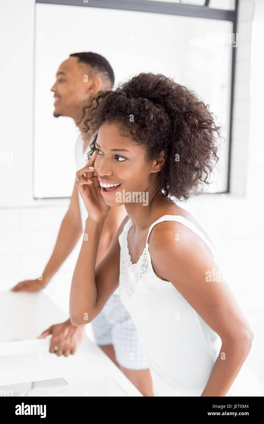 Concerned woman checking skin hi-res stock photography and images - Alamy