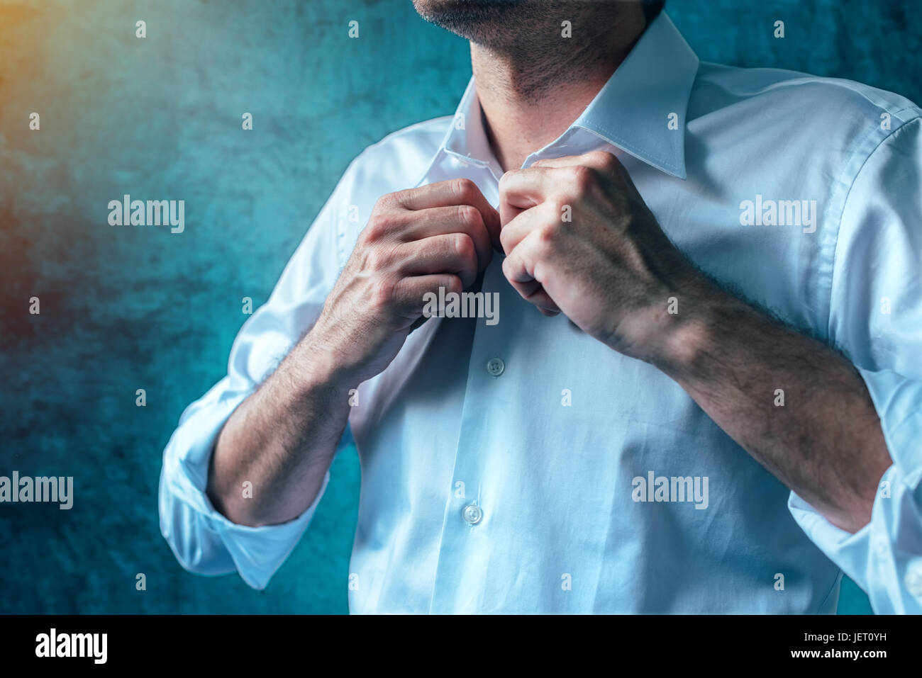 Businessman getting dressed for job interview, man buttoning white ...