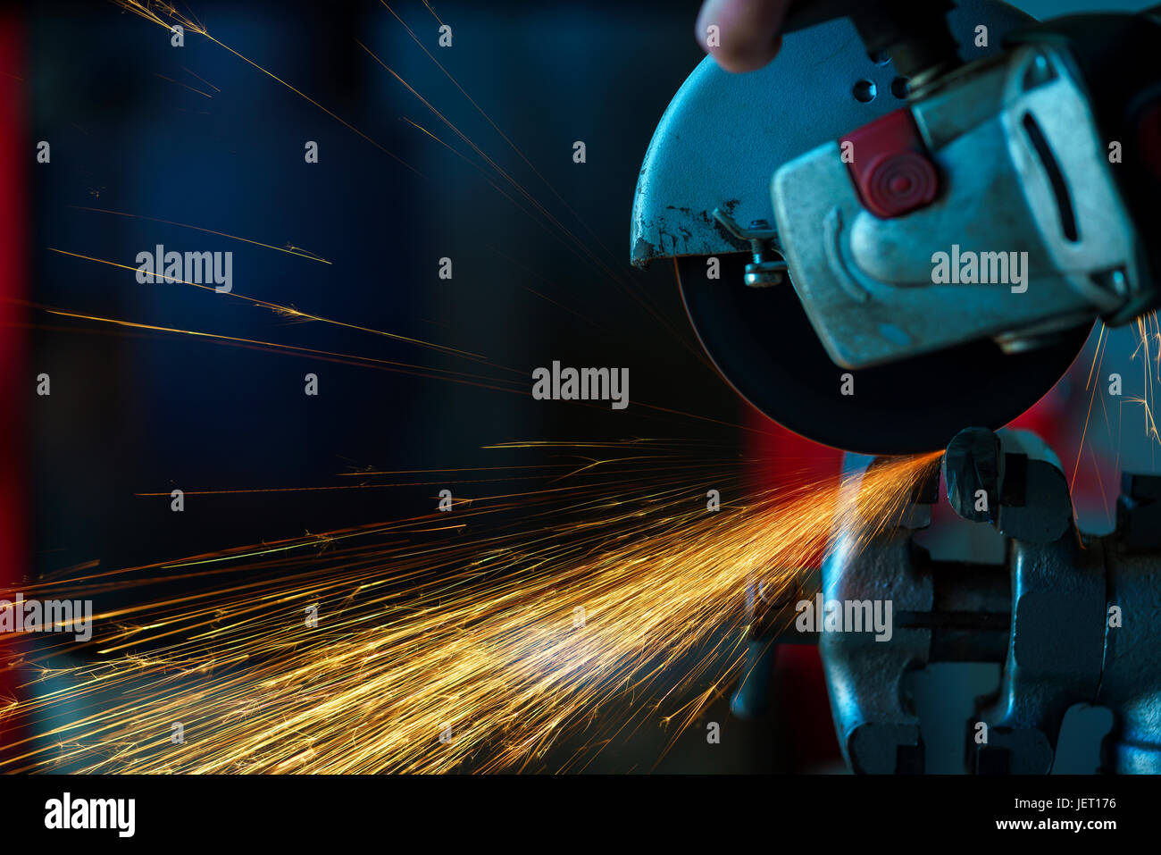Angular grinding machine is cutting the metal and a lot of sparks ...