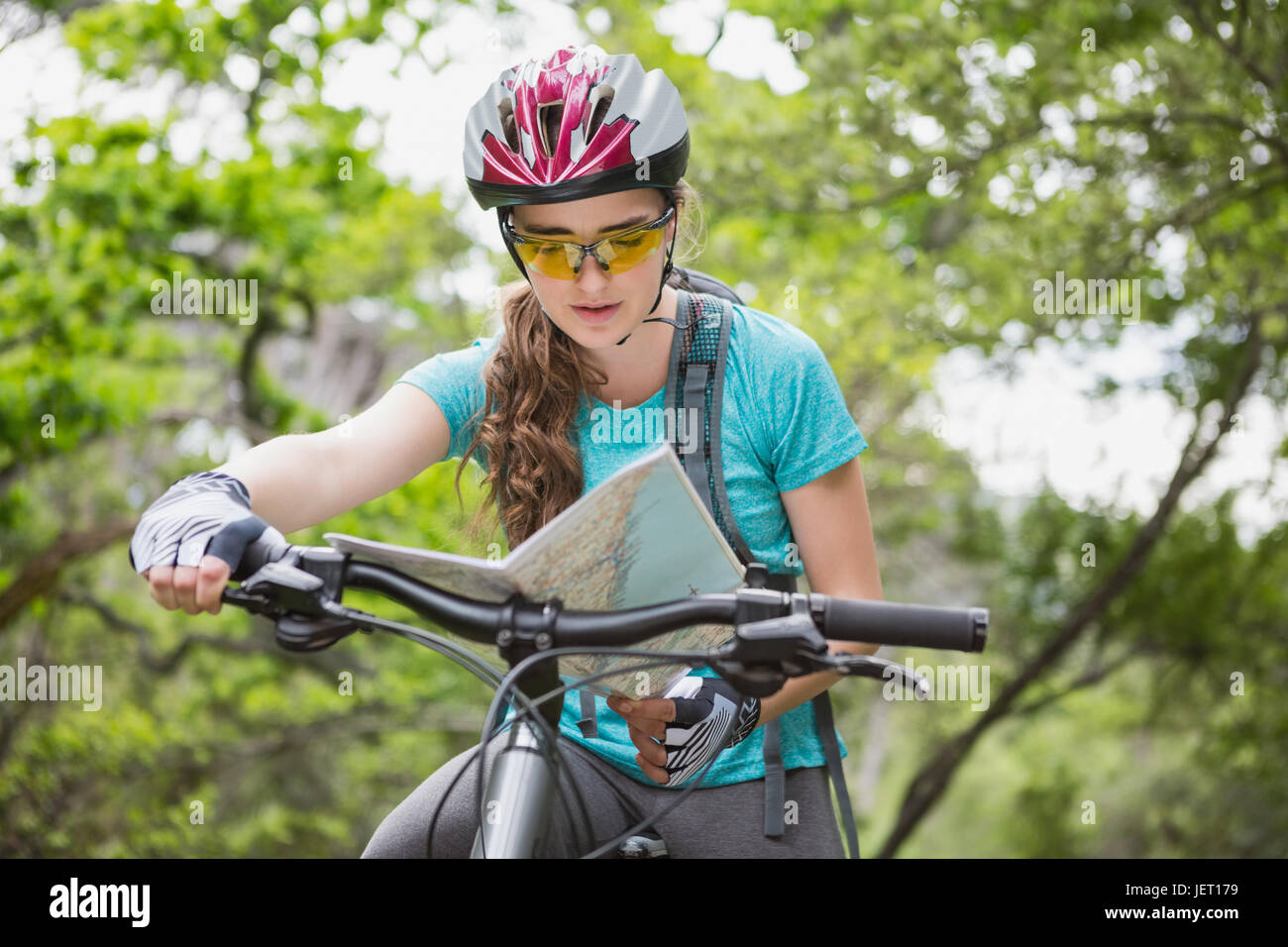 Woman checking the map Stock Photo - Alamy