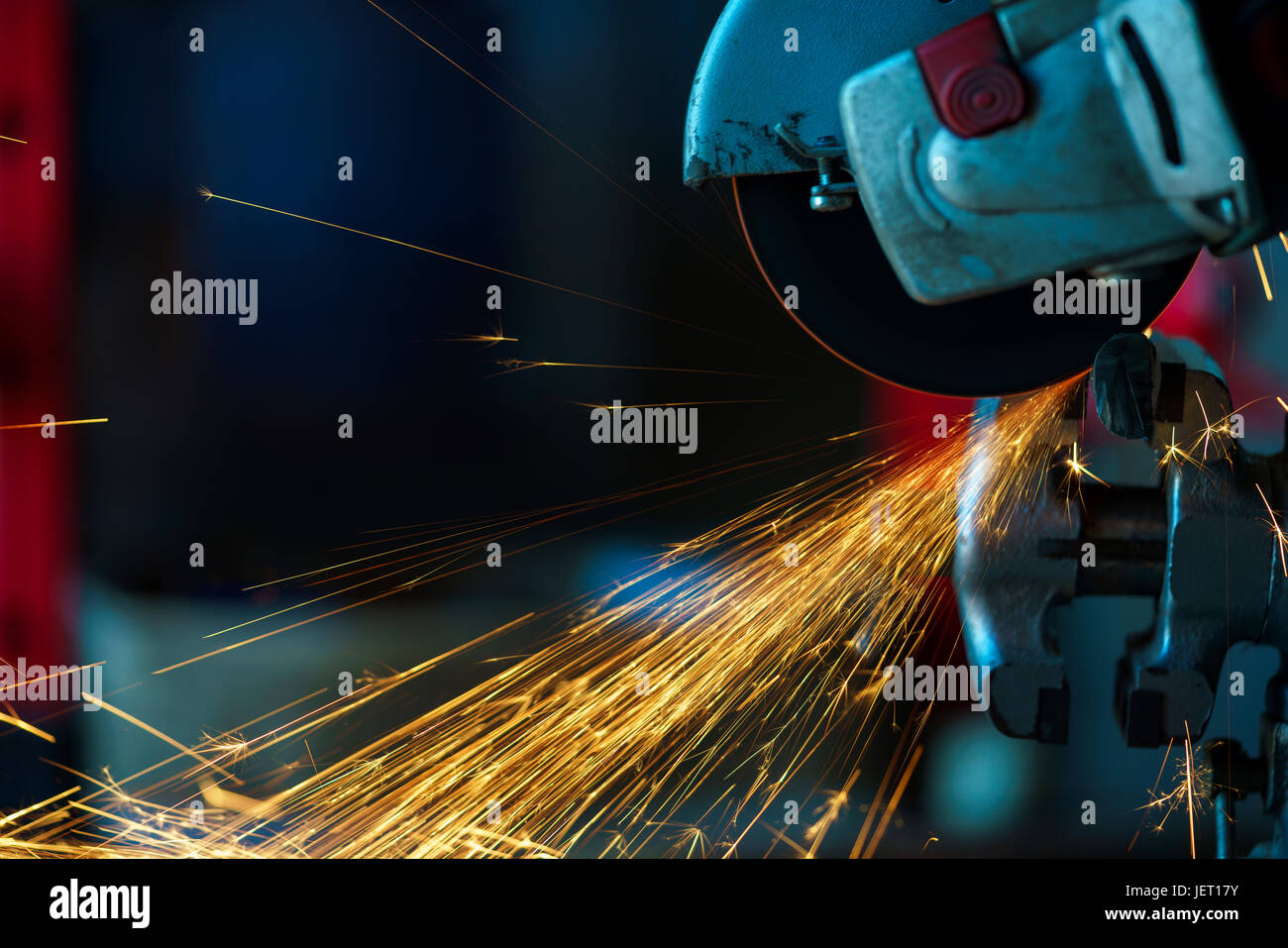 Angular grinding machine is cutting the metal and a lot of sparks ...