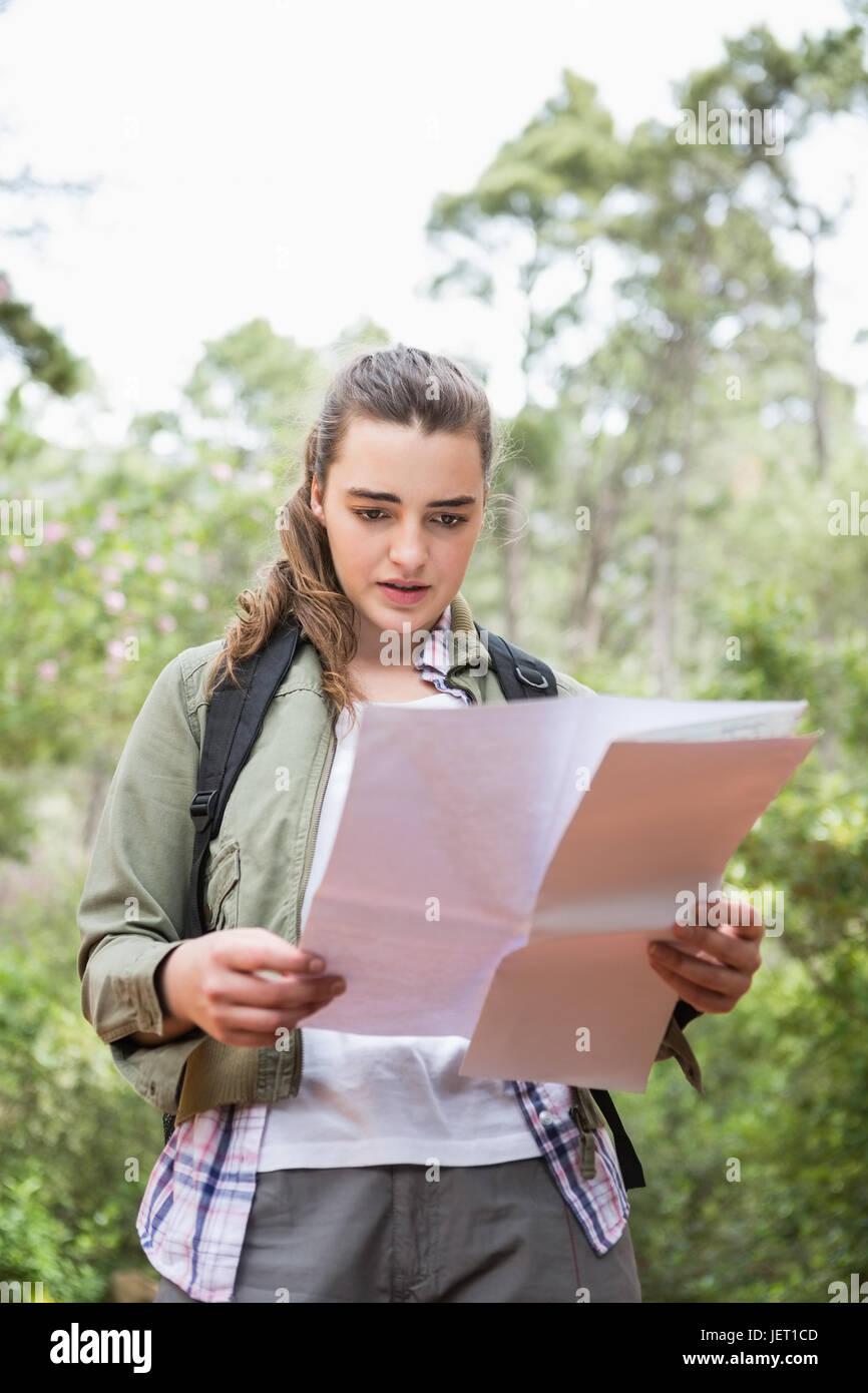Woman checking the map Stock Photo - Alamy