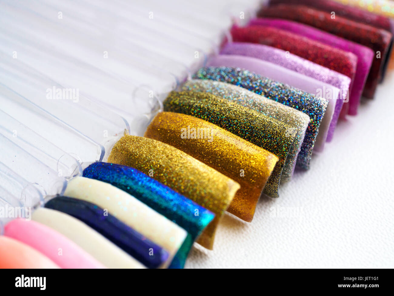 Background from different colorful nails polish palette for a manicure ...