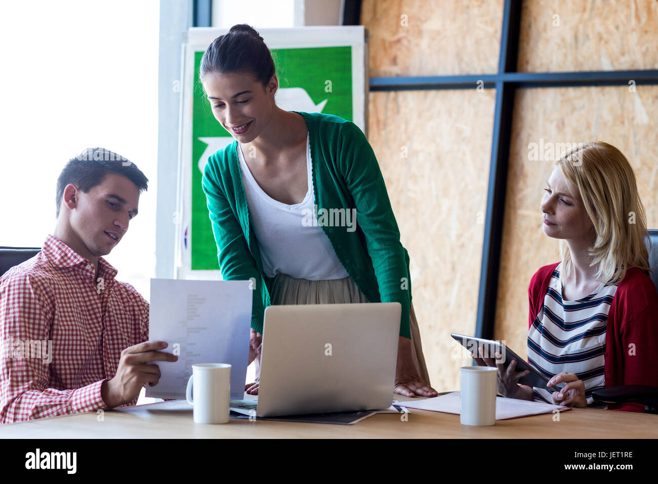 Business colleagues interacting other desk hi-res stock photography and ...