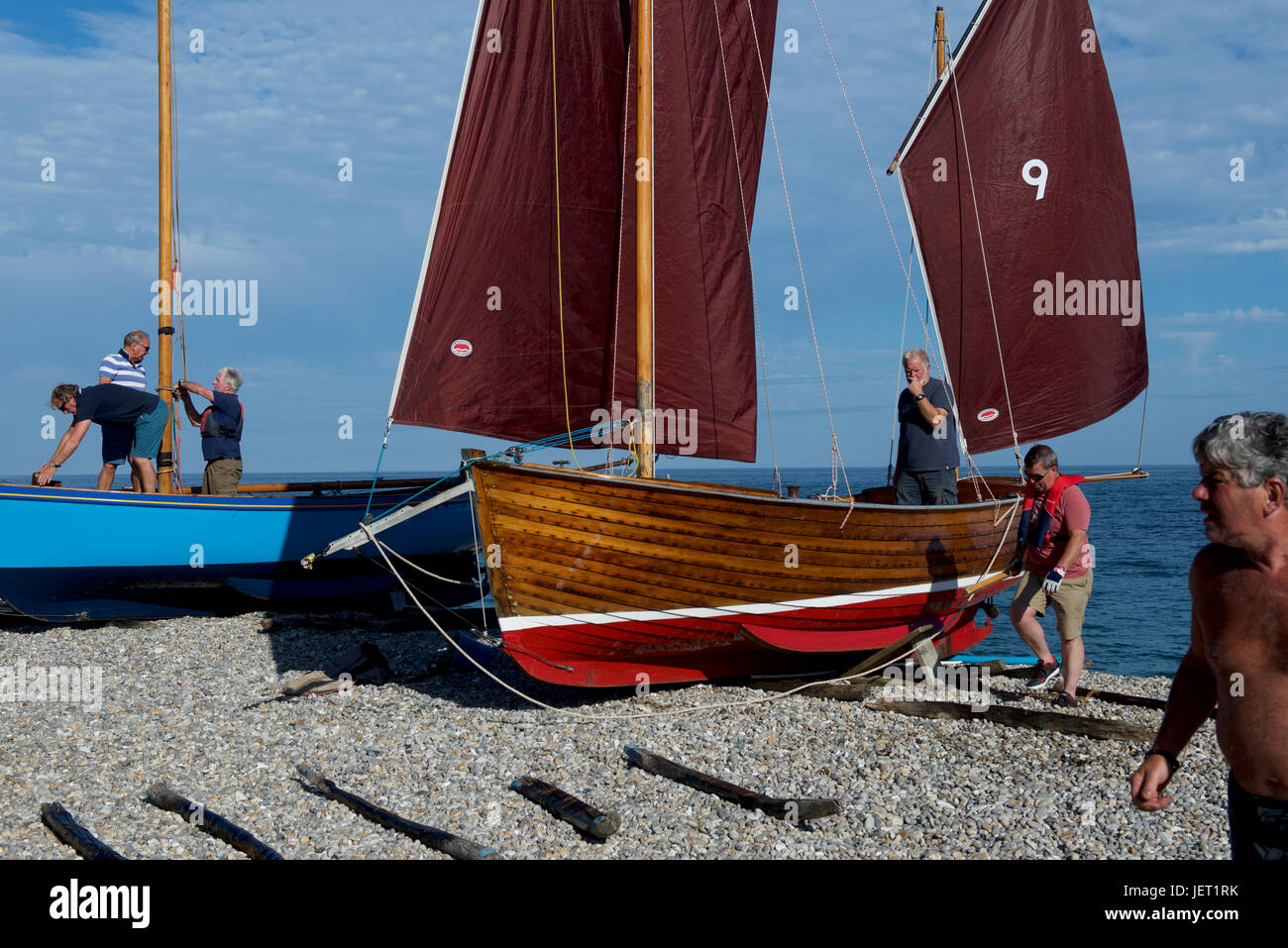 Men rigging boat (lugger) on the beach, Beer, Devon, England UK Stock ...
