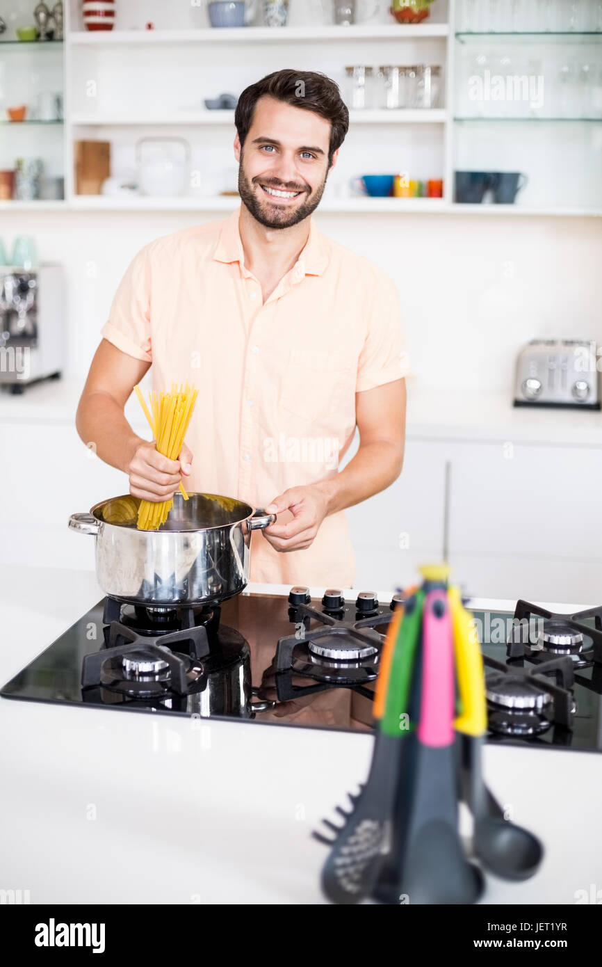 Man cooking spaghetti Stock Photo - Alamy