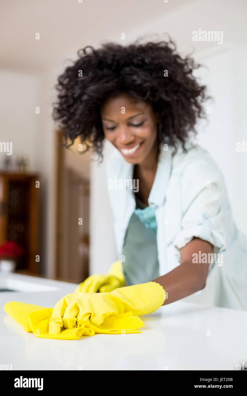 Woman cleaning kitchen counter Stock Photo - Alamy