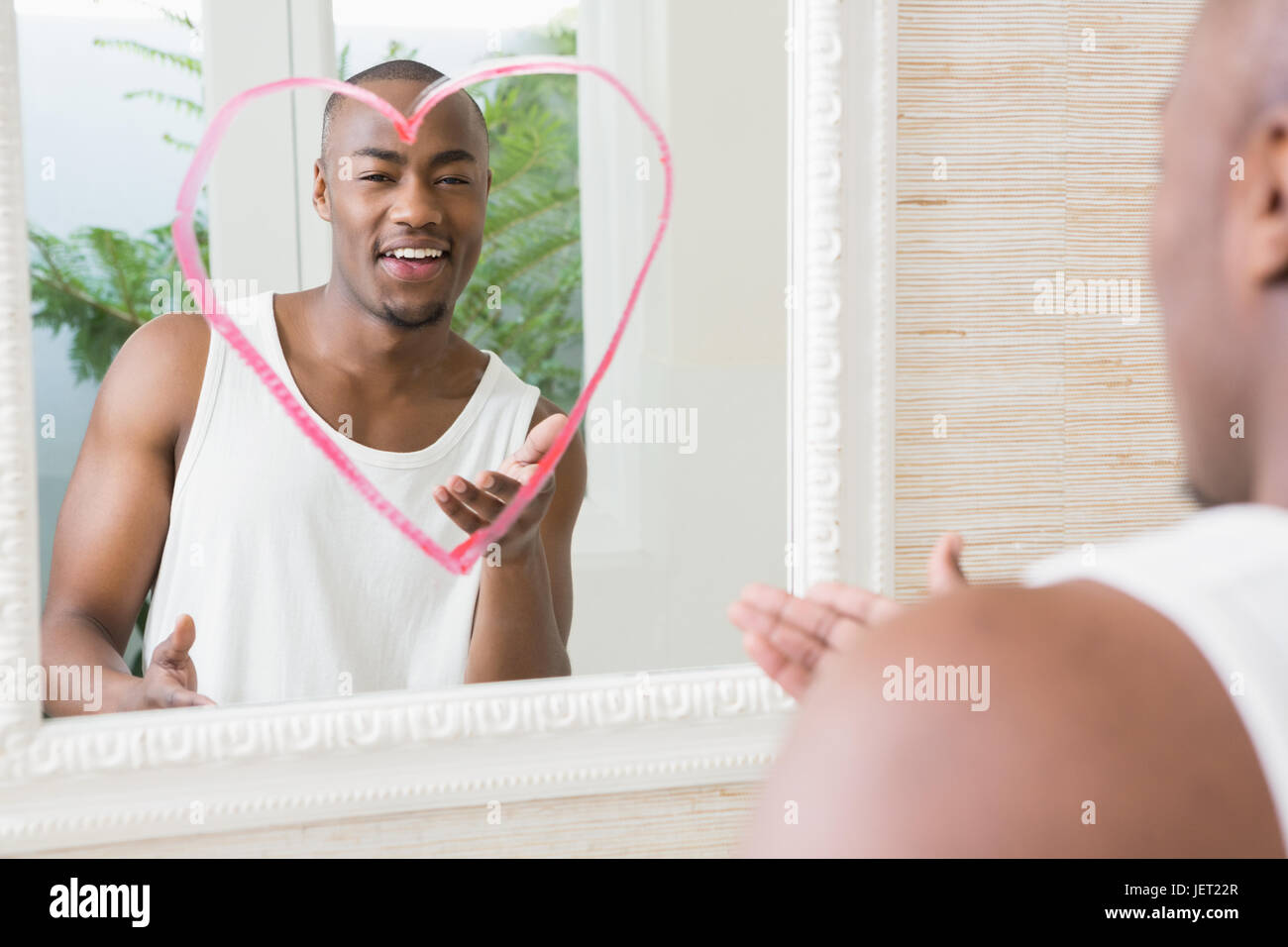 Man looking in the mirror Stock Photo - Alamy