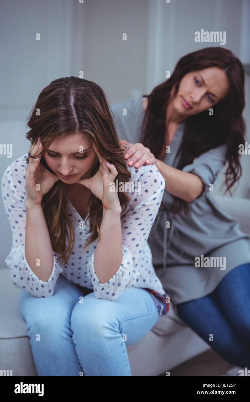 Woman comforting her upset friend Stock Photo - Alamy