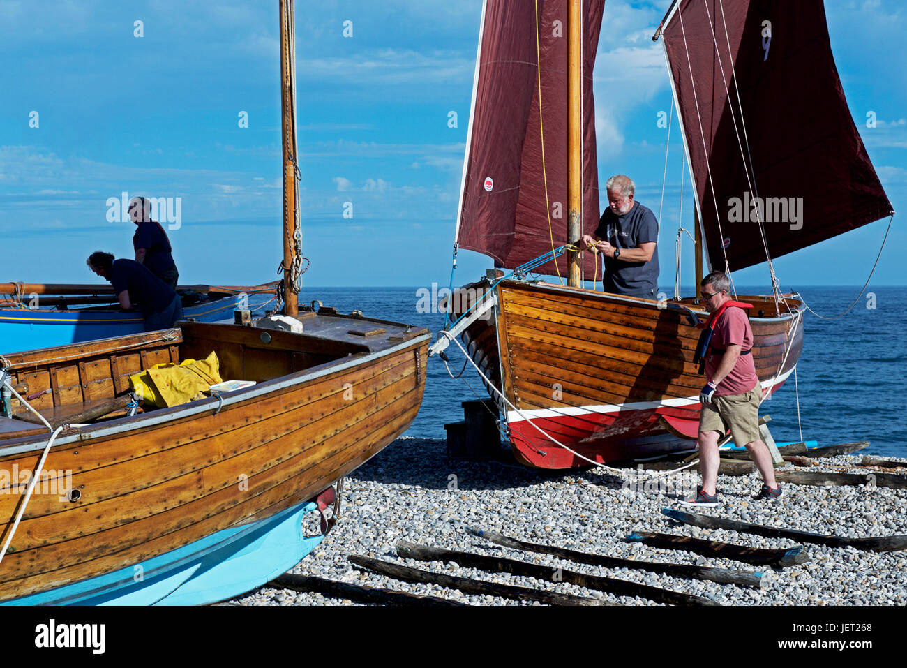Men rigging boats (luggers) on the beach, Beer, Devon, England UK Stock ...