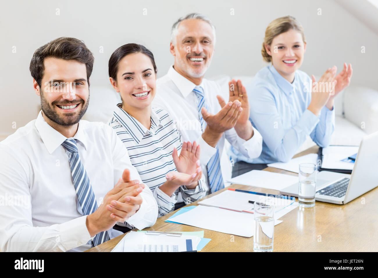 Business colleagues applauding in a meeting Stock Photo - Alamy