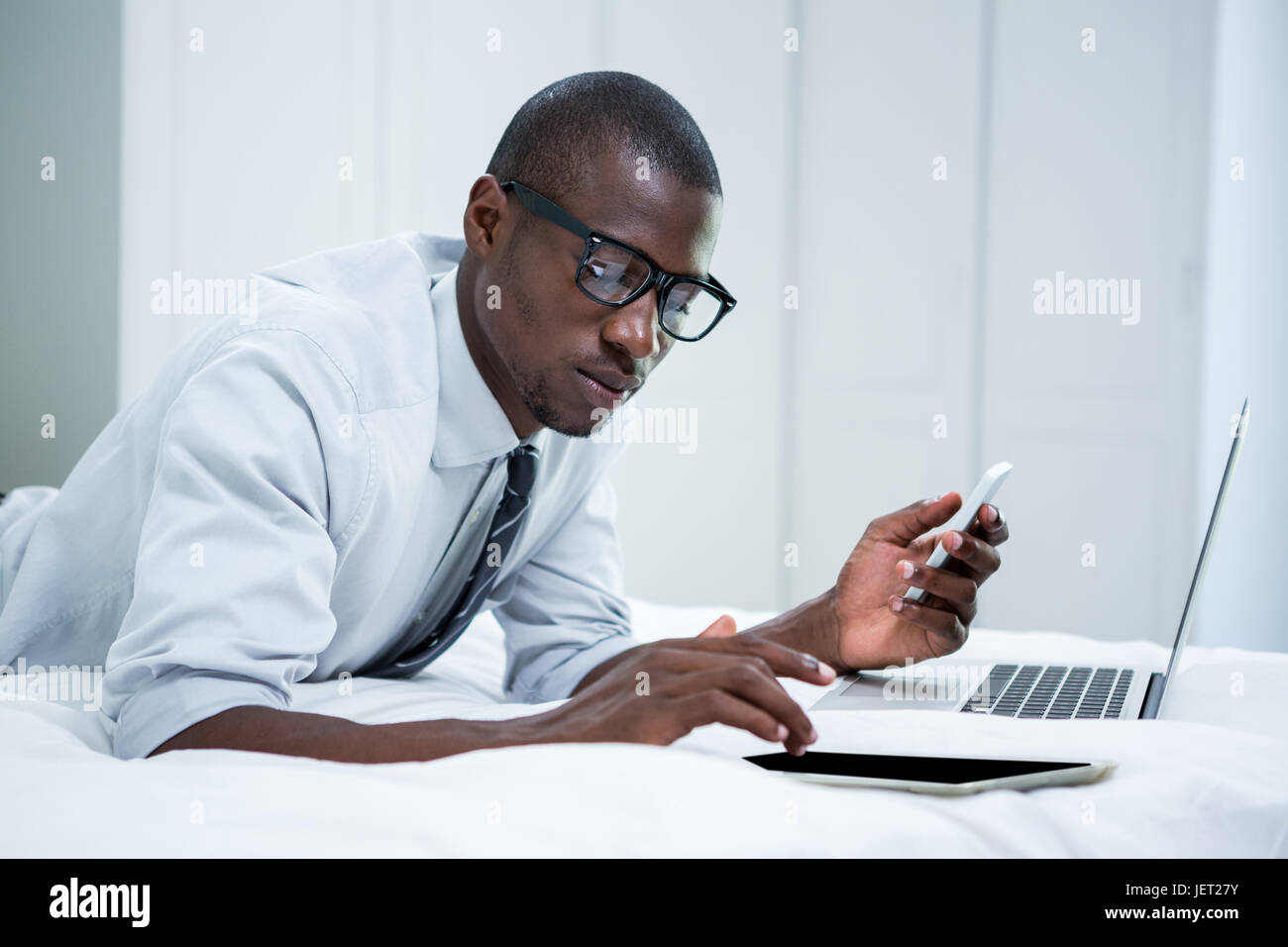 Scrolling on phone young man hi-res stock photography and images - Alamy