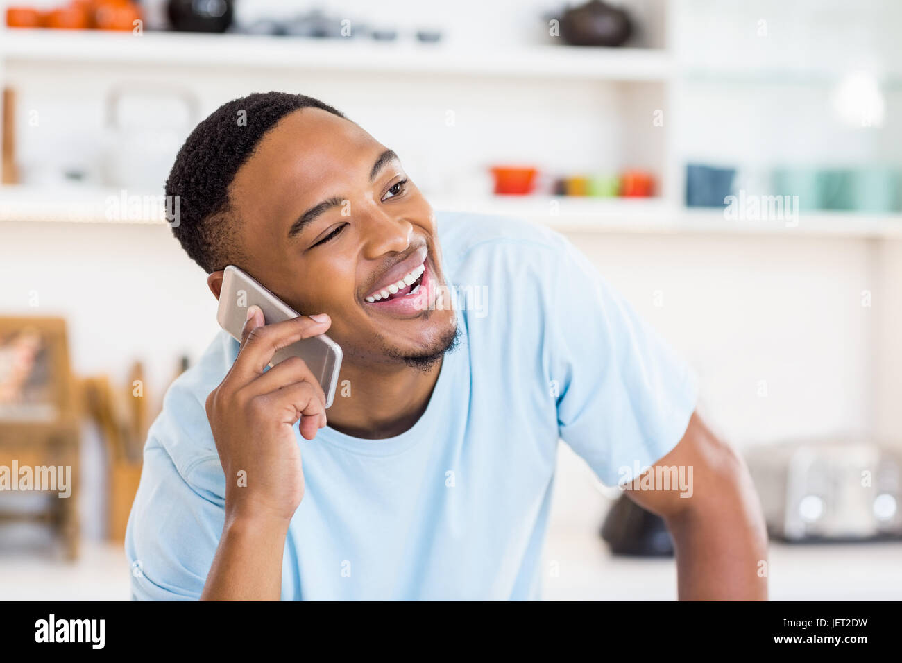 Happy man talking on mobile phone Stock Photo - Alamy