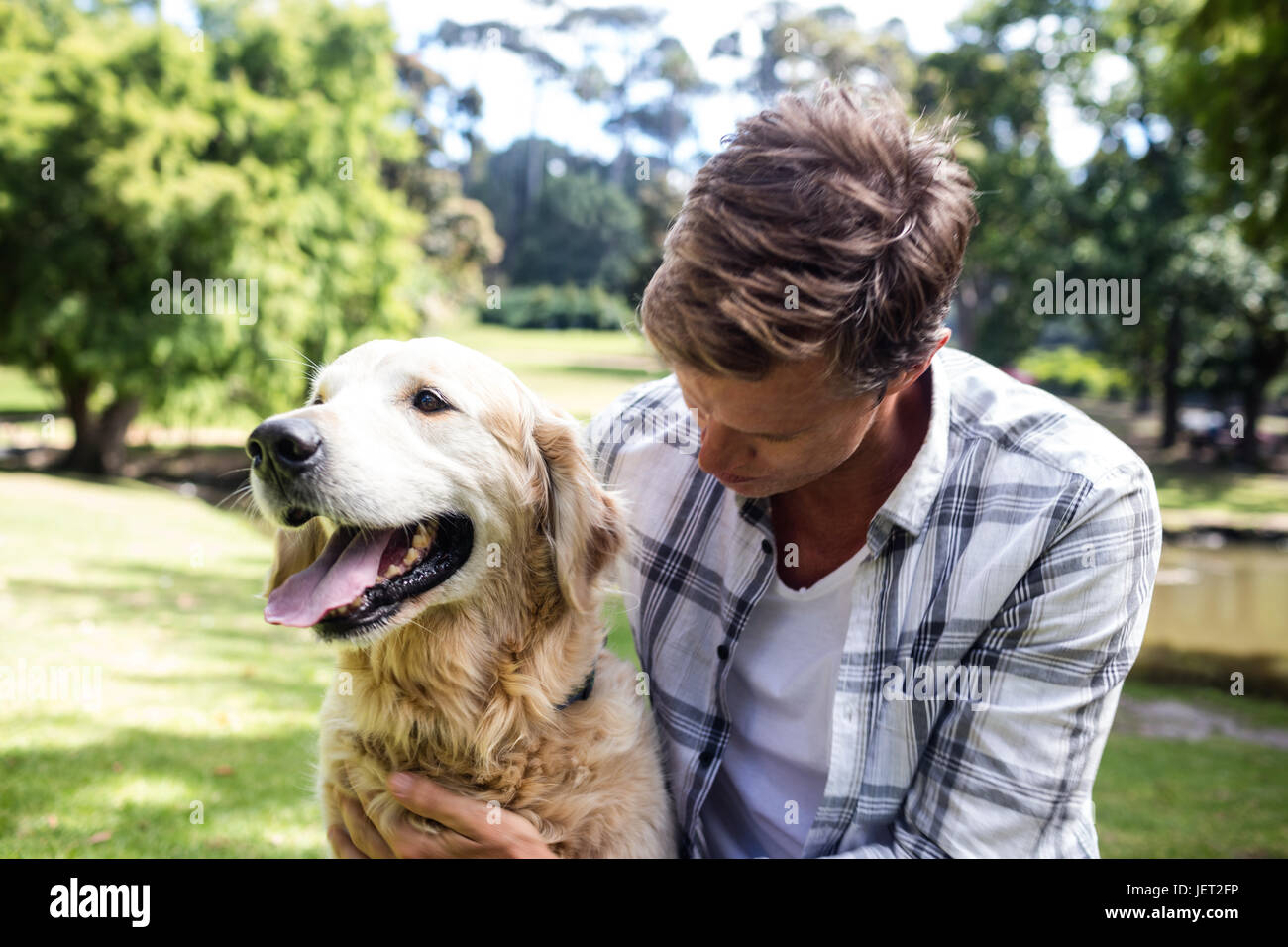 A Man is with his pet dog Stock Photo - Alamy
