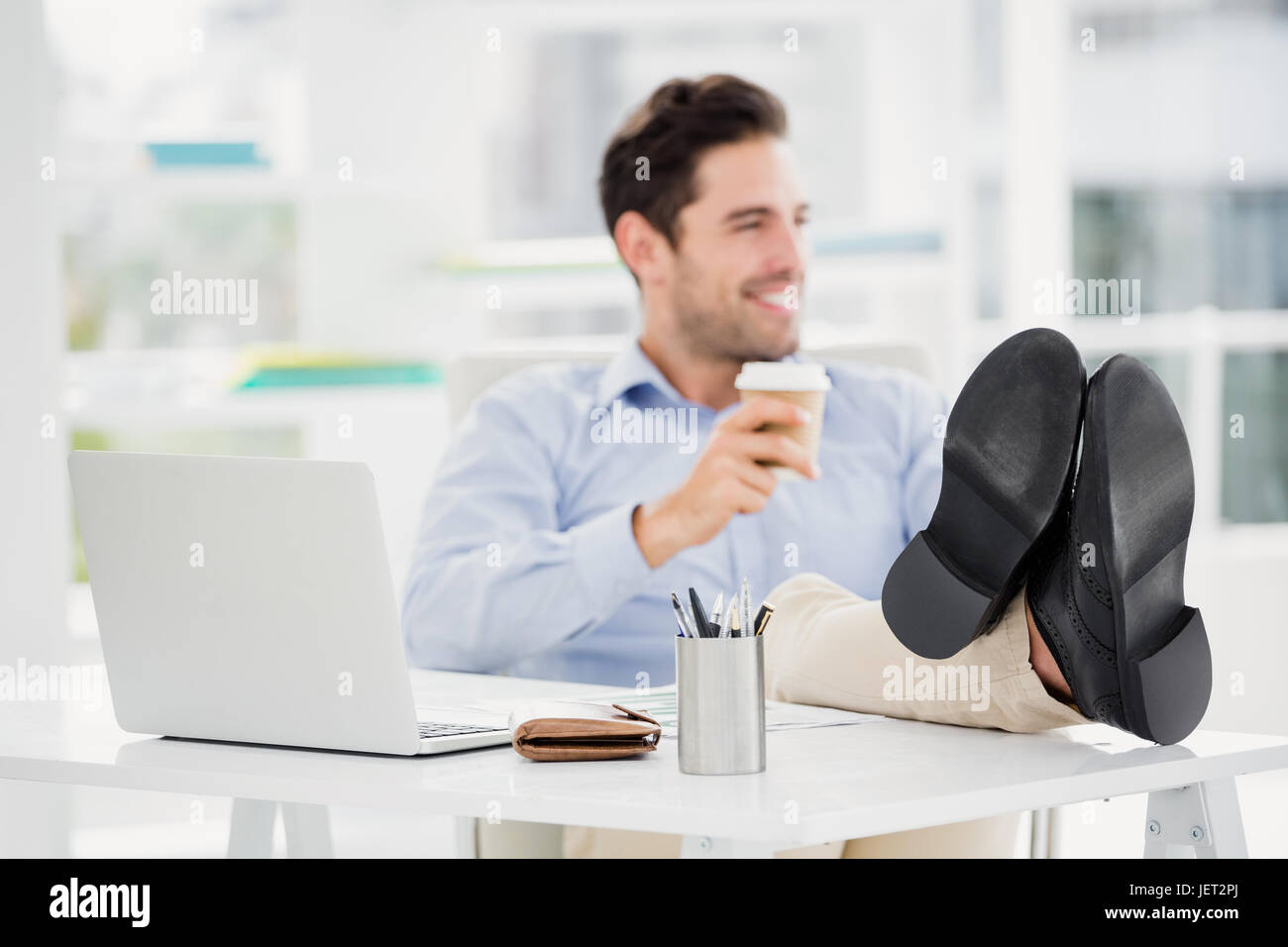 Feet on coffee table hi-res stock photography and images - Alamy