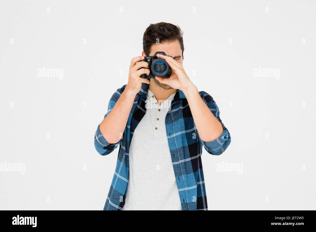 Man photographing with camera Stock Photo - Alamy