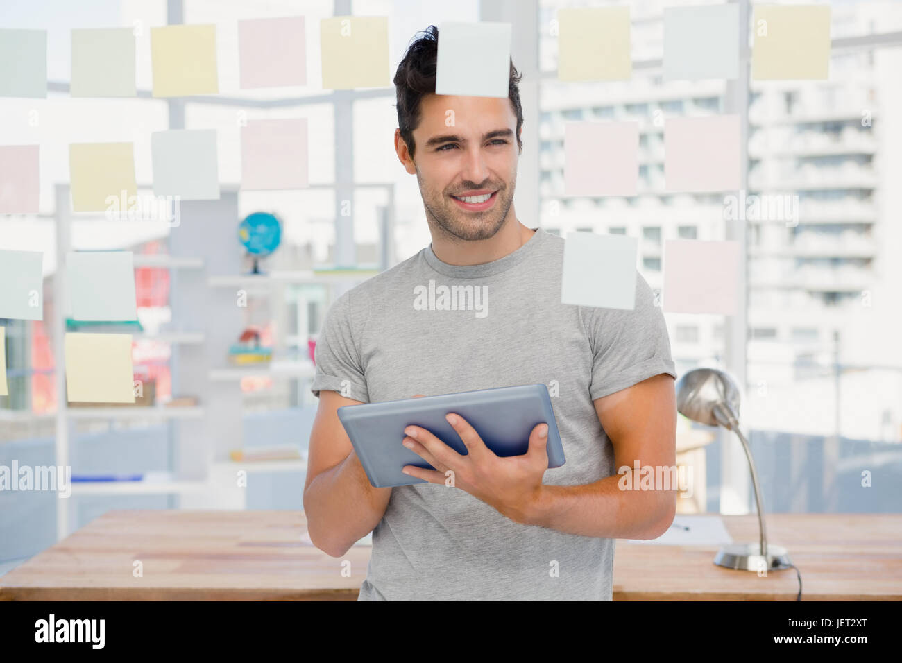 Man holding digital tablet and sticky notes Stock Photo - Alamy