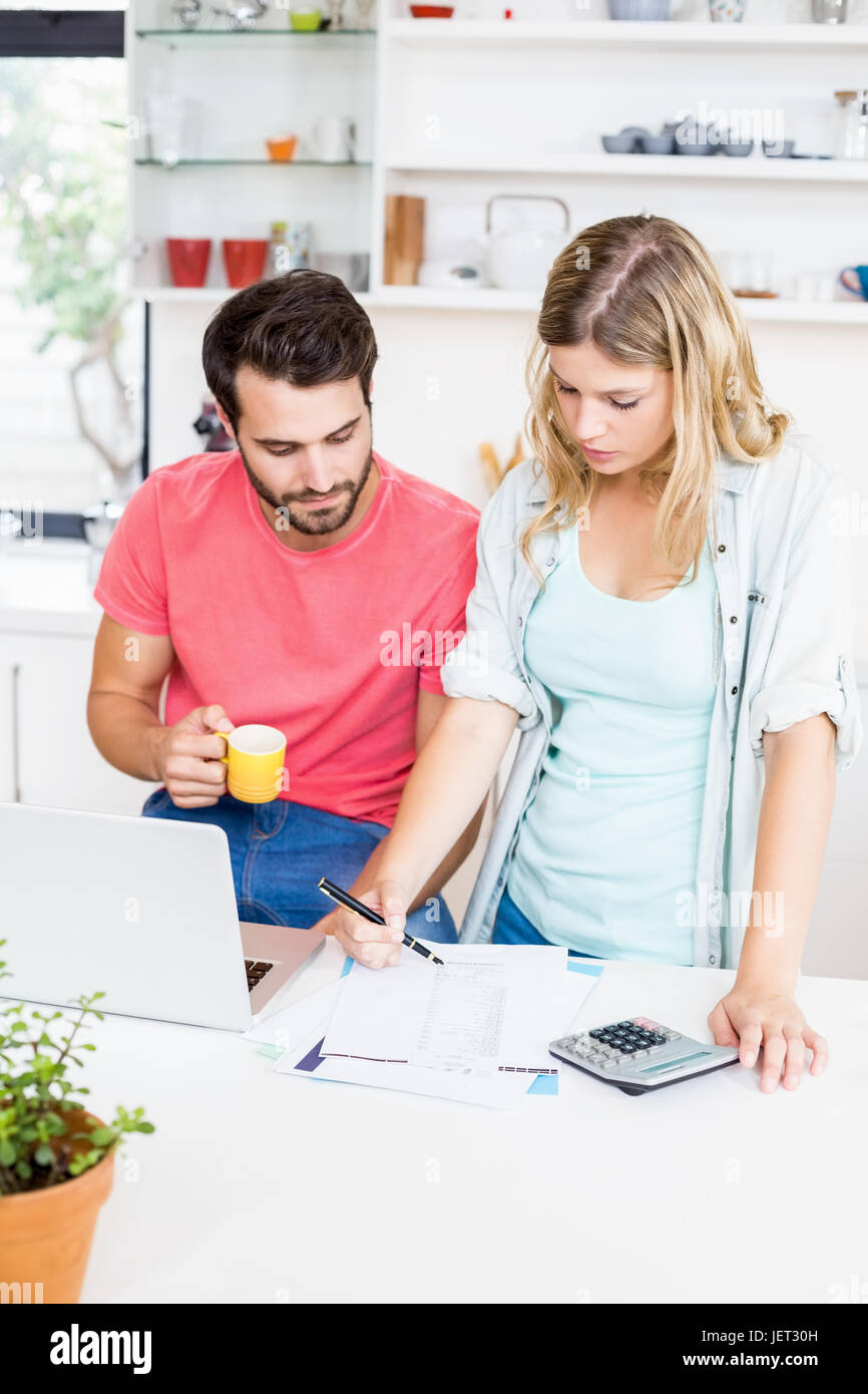 Worried young couple discussing bills Stock Photo - Alamy