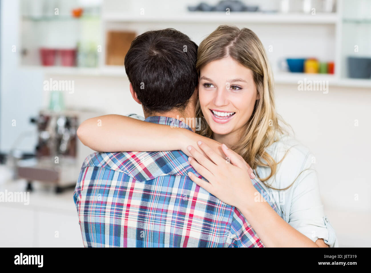Young couple cuddling Stock Photo - Alamy