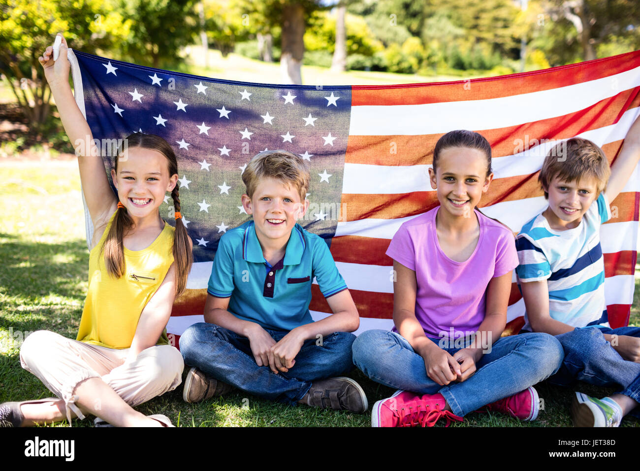 Children holding american flag in hi-res stock photography and images ...